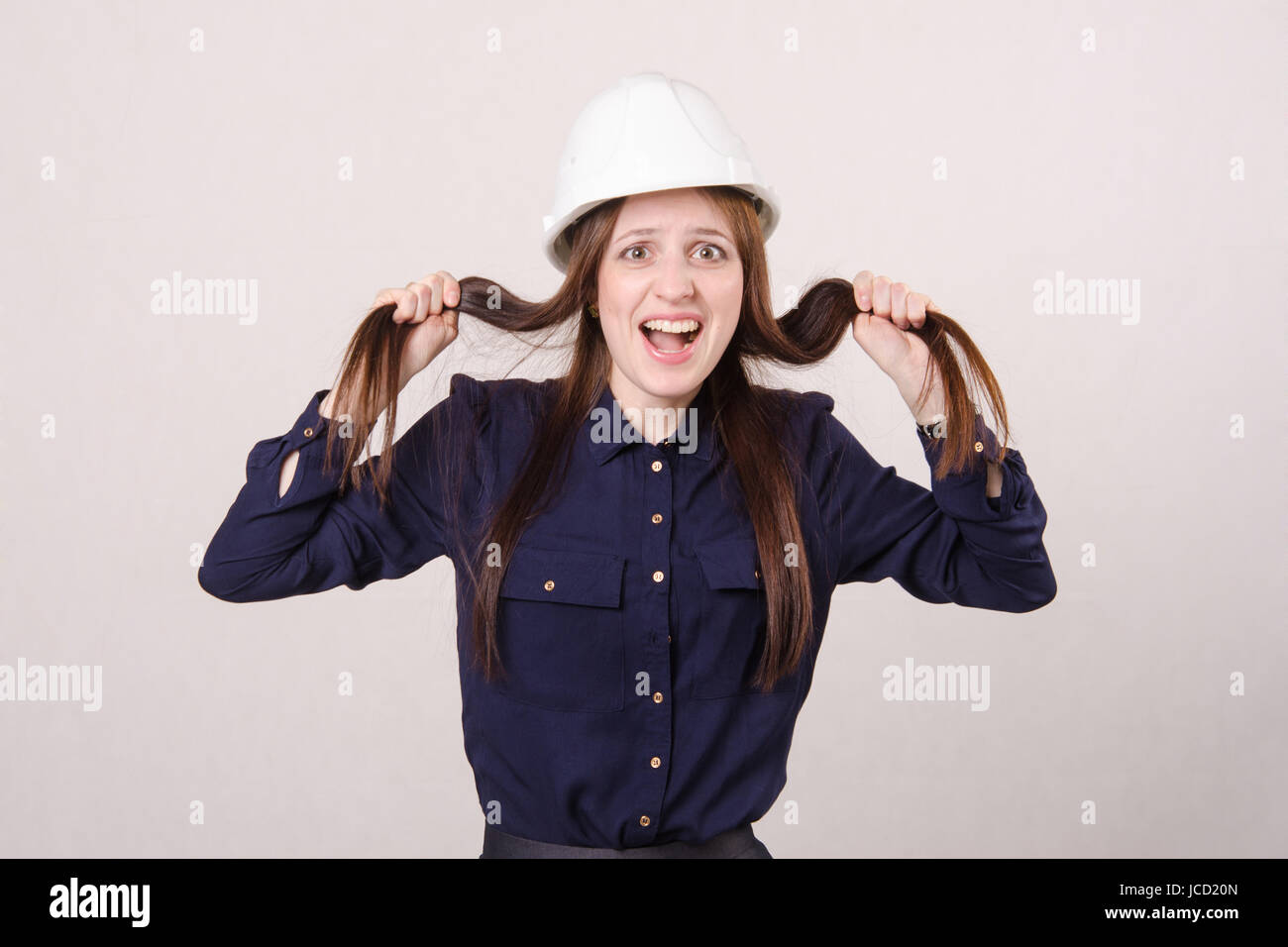 Portrait of a young beautiful girl engineer, architect in helmet Stock ...