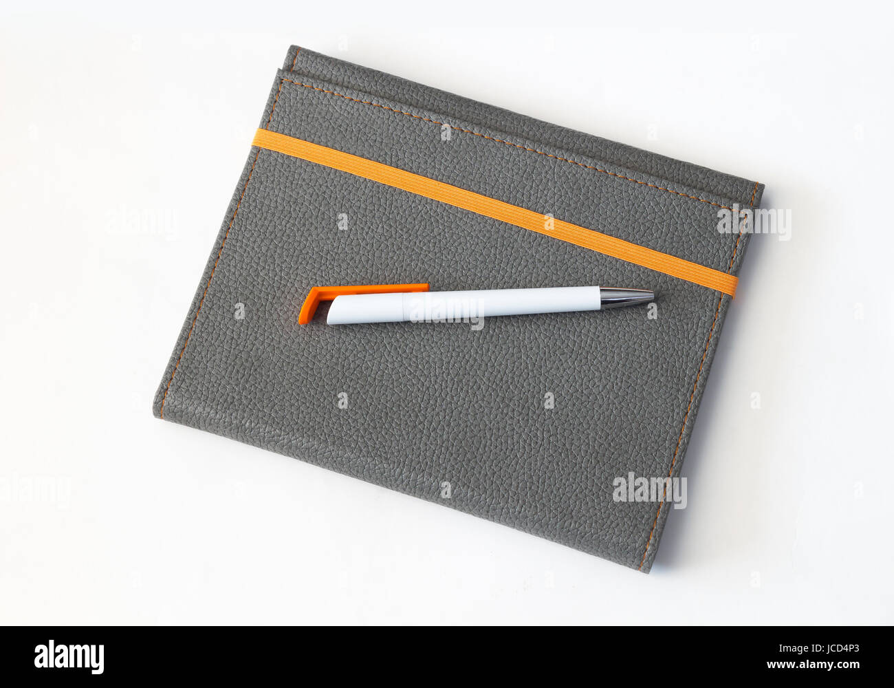 Leather notebook with pen closeup Stock Photo - Alamy