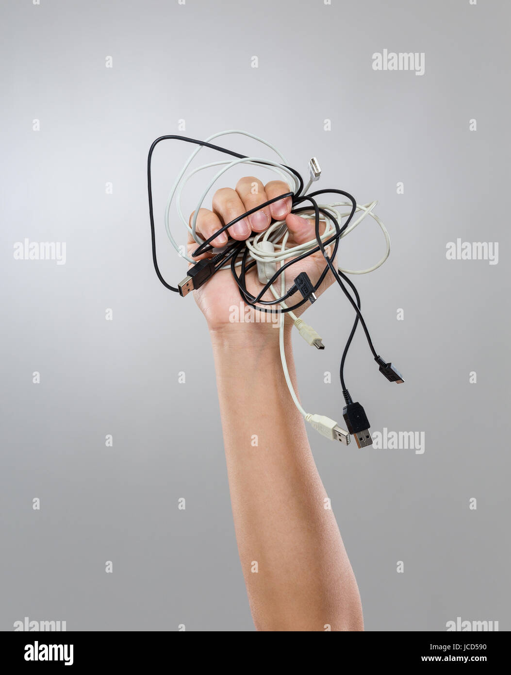 Man hand grasp of cable wire Stock Photo - Alamy