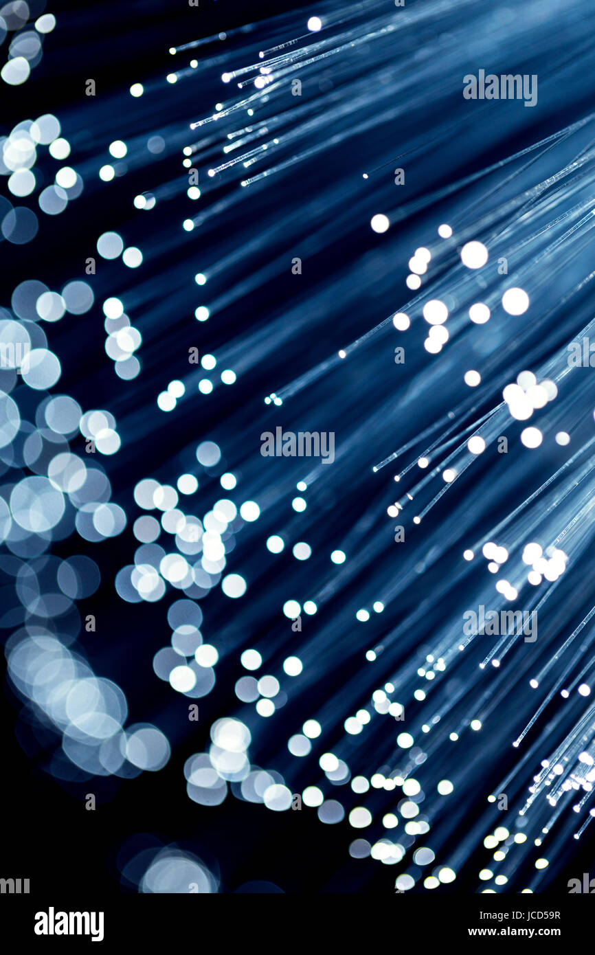 Blue high tech fiber optic background Stock Photo - Alamy