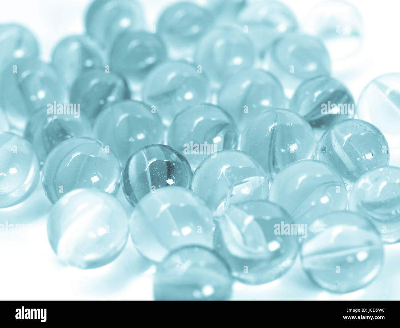 Coloured glass marble spheres toy background pattern - cool cyanotype ...
