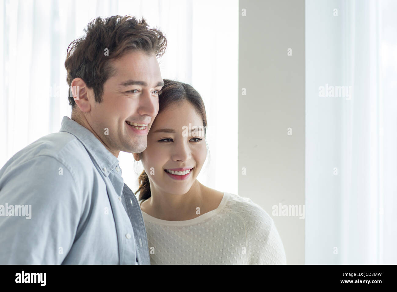 Portrait of smiling multicultural family couple Stock Photo - Alamy