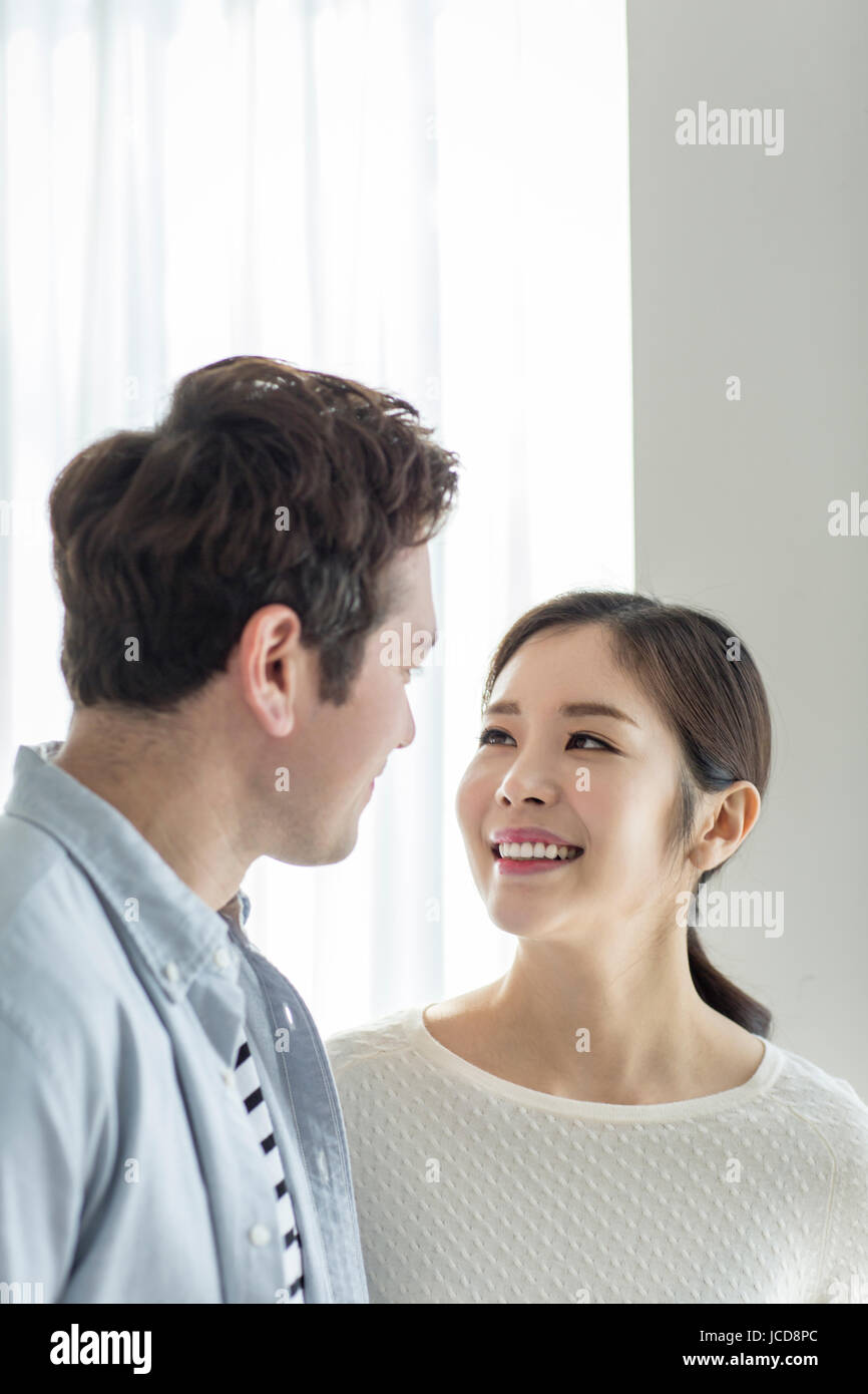 Smiling multicultural family couple Stock Photo - Alamy