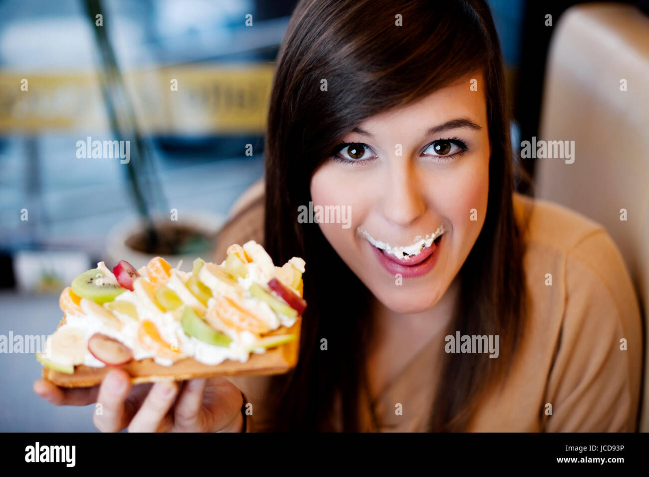 Woman licking whipped cream hi-res stock photography and images - Alamy
