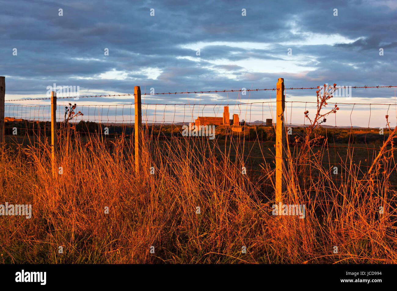 Romanesque San Pietro ( St. Peter) Basilica Church at sunset with fence ...