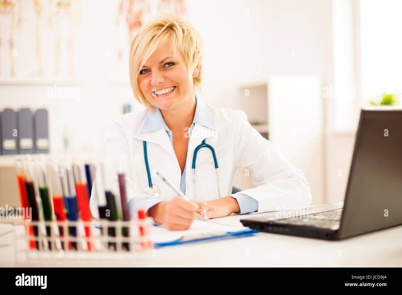 Female doctor hard working in her office Stock Photo - Alamy