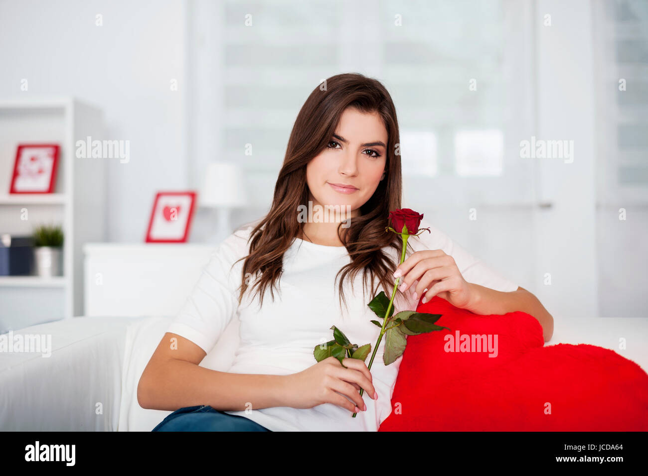 Beautiful woman with red rose Stock Photo - Alamy