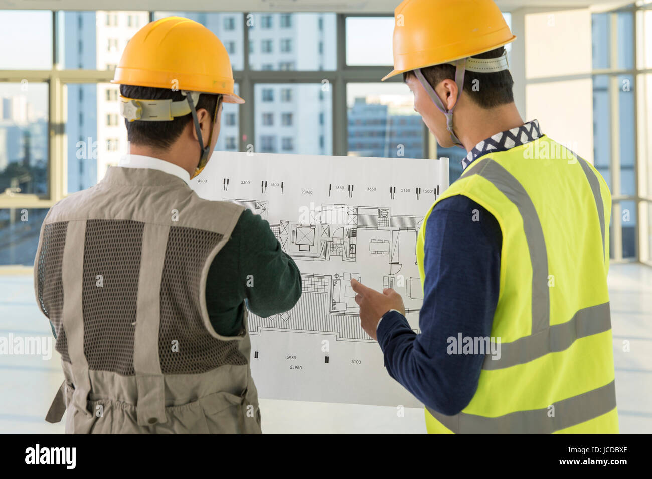 Back of two architects Stock Photo - Alamy