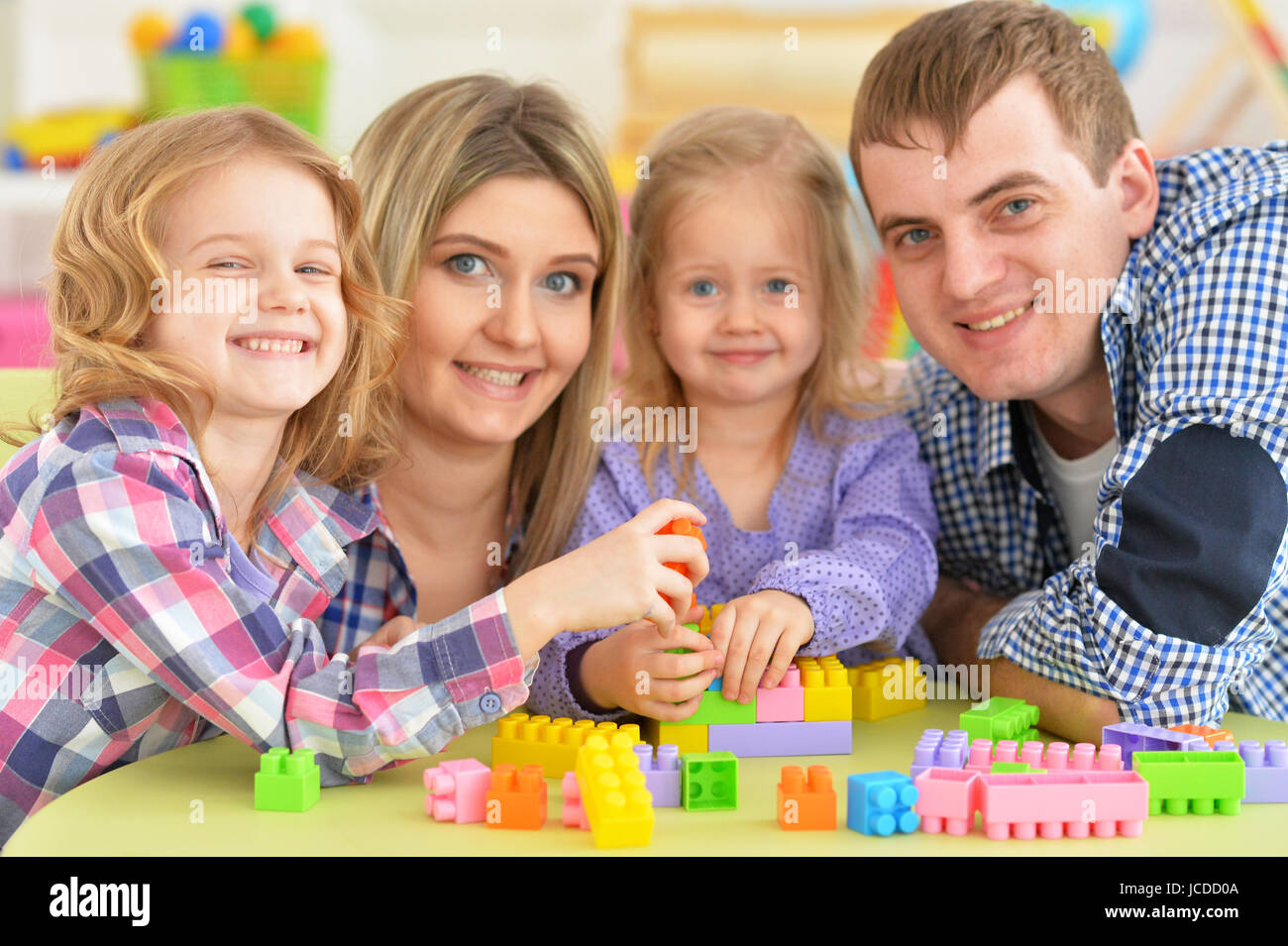 Portrait of a friendly happy family playing together Stock Photo - Alamy