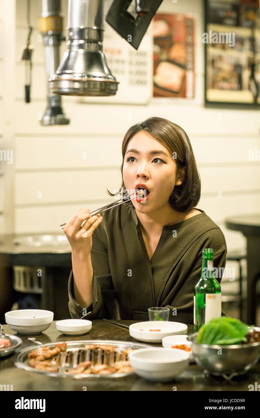 Portrait of single woman at restaurant Stock Photo - Alamy