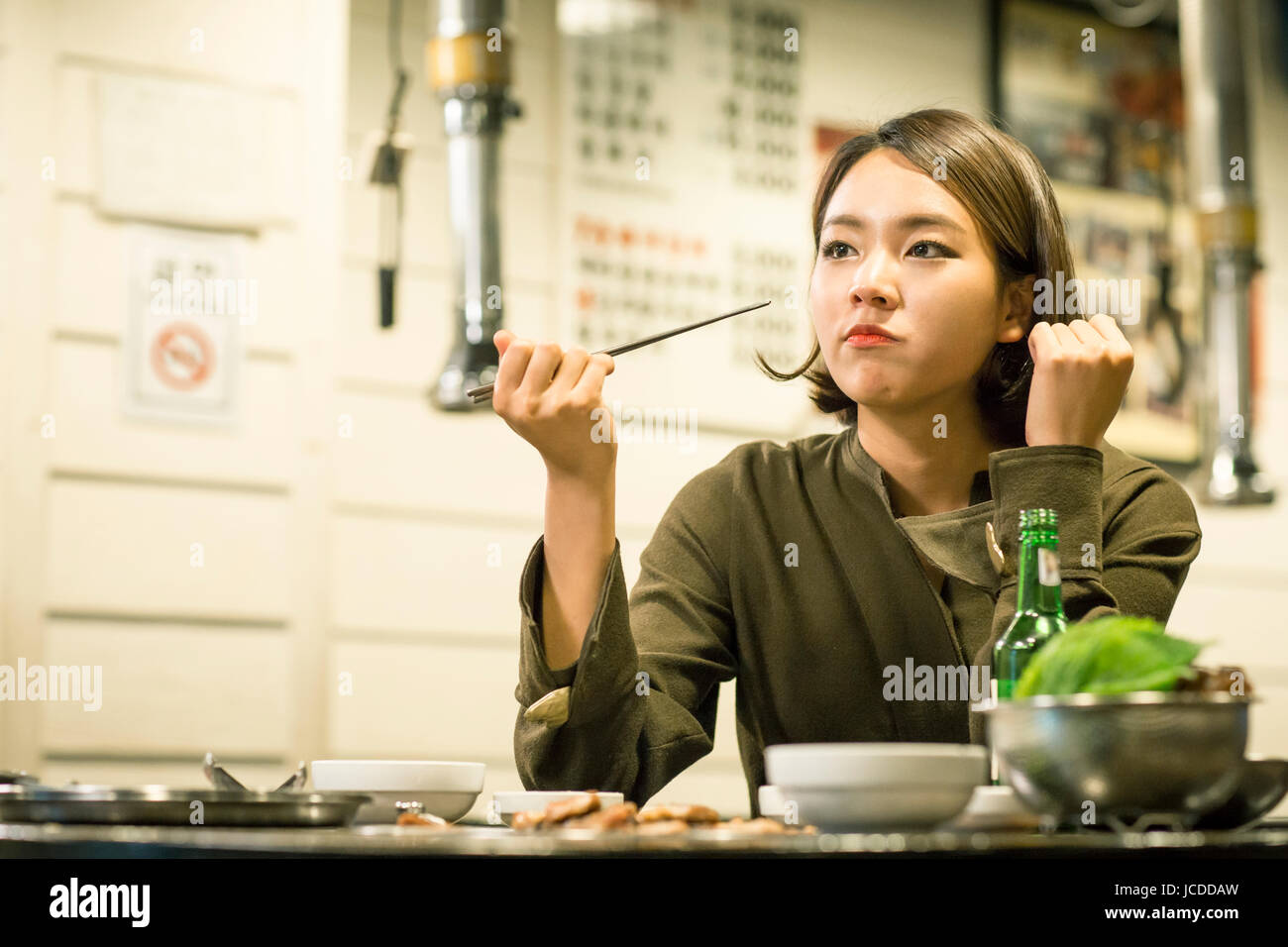 Portrait of single woman having meal at restaurant Stock Photo - Alamy