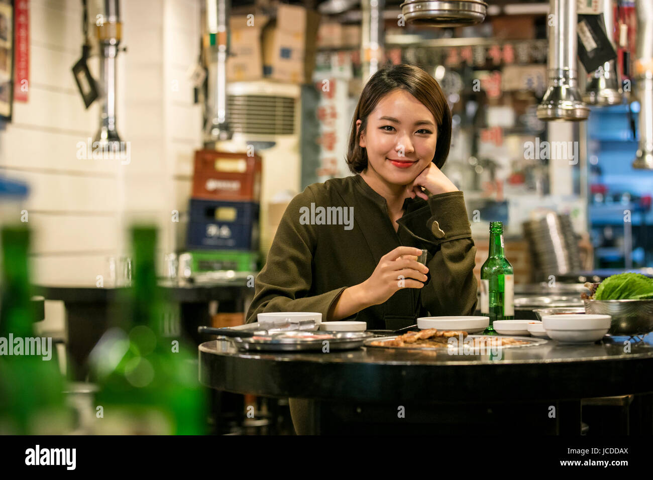 Portrait of smiling single woman at restaurant Stock Photo - Alamy