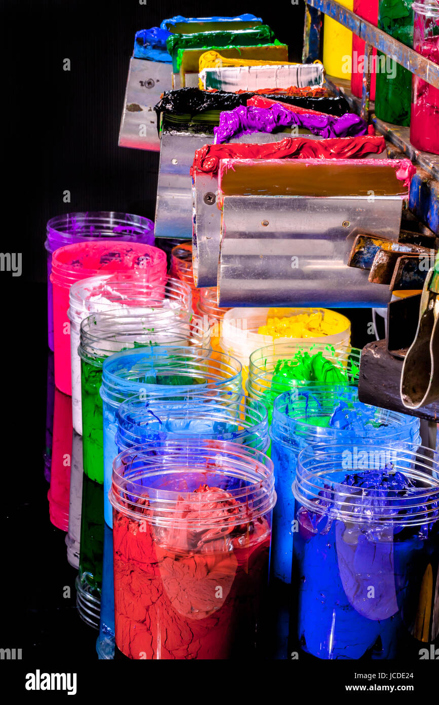 ink on rubber handle hang on place above plastisol ink in cans ready ...