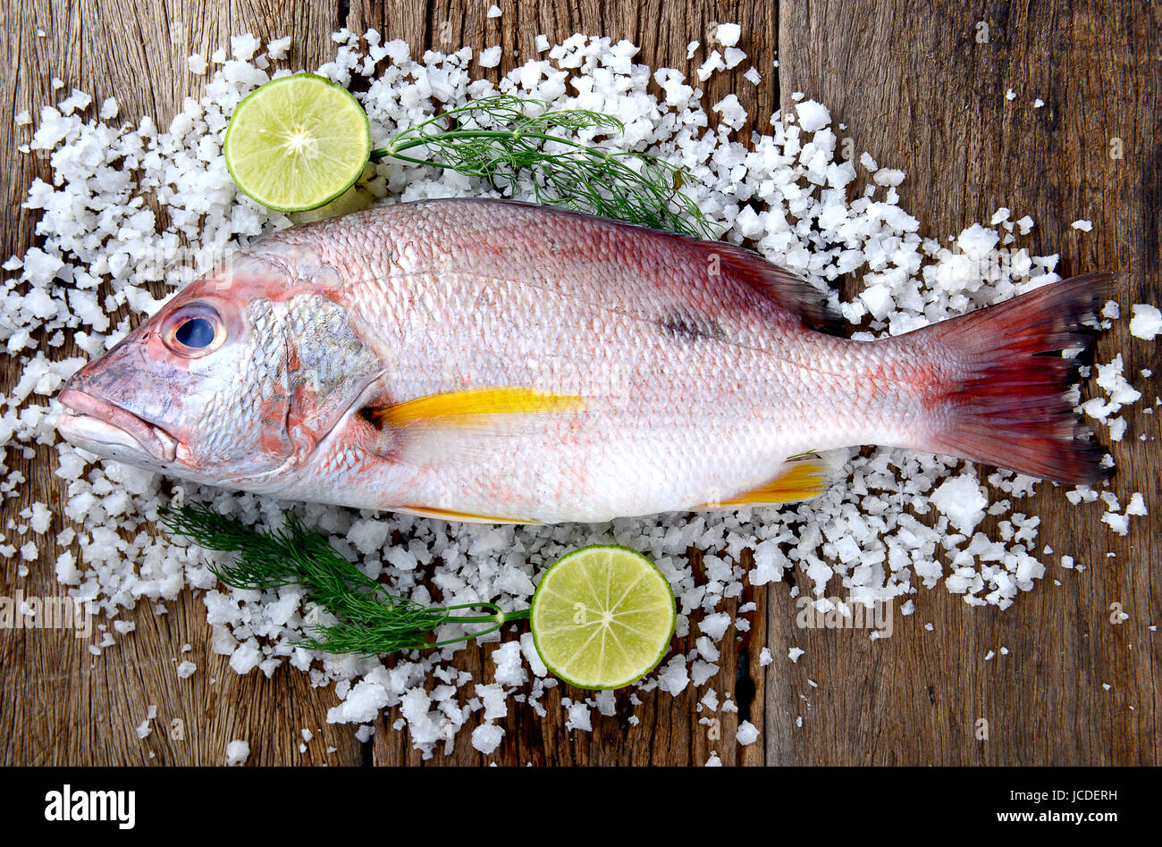 Fresh red snapper fish from fishery market with salt and lemon set on ...