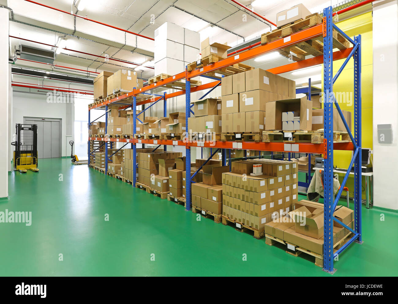 Shelf with goods in storage warehouse room Stock Photo - Alamy