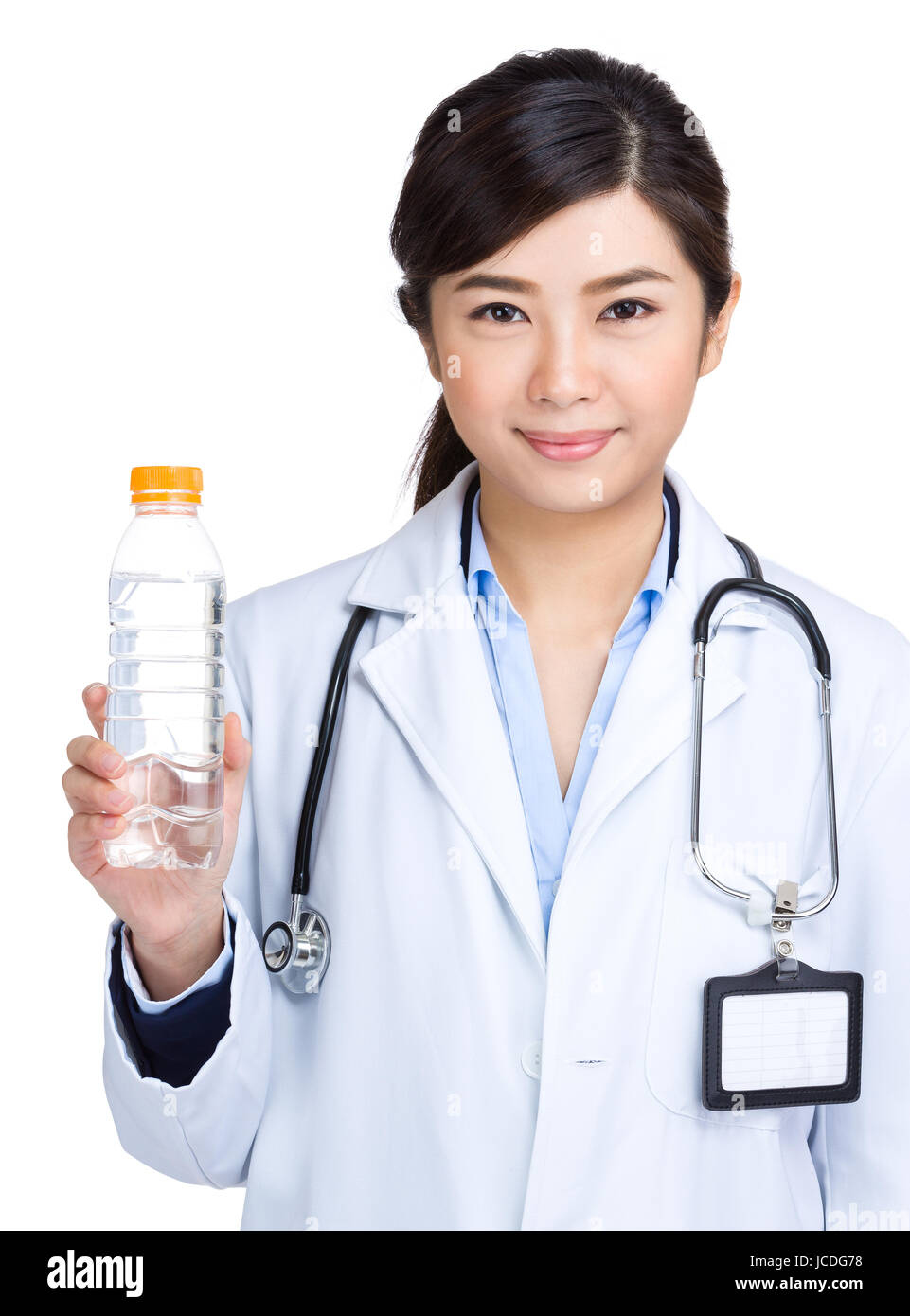 Friendly female doctor holding bottle hi-res stock photography and ...