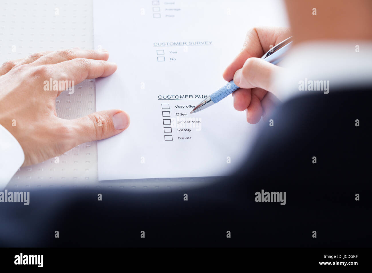 Close-up Of Human Hand Filling Customer Survey Form Stock Photo - Alamy