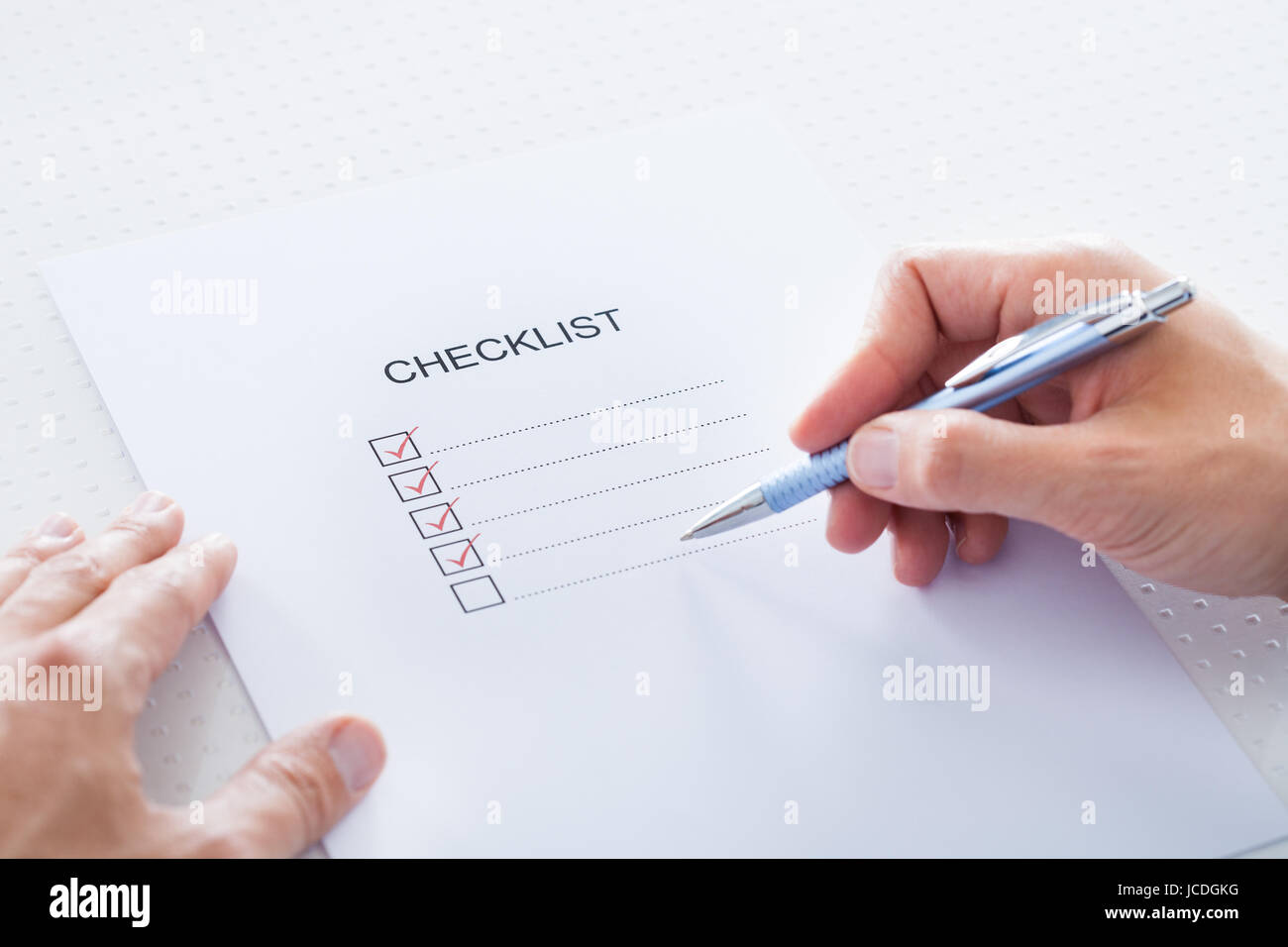 Close-up Of Human Hand Filling Check Boxes On Form Stock Photo - Alamy