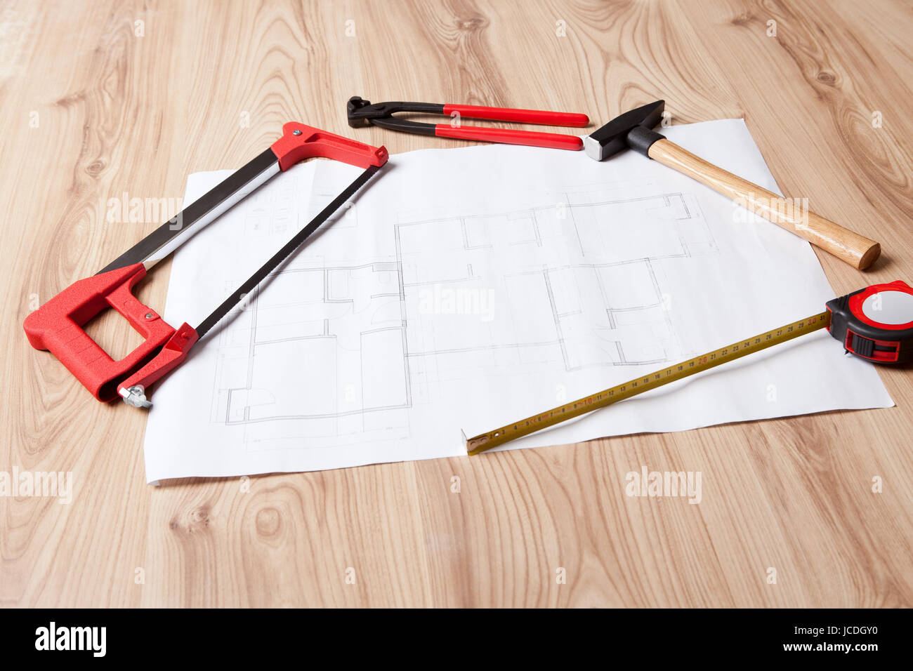 Photo of carpenter tools and building plan Stock Photo - Alamy