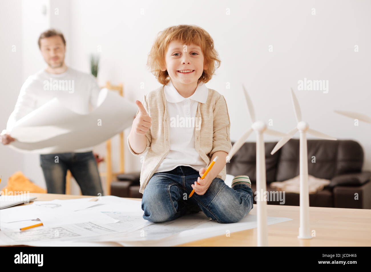 Positive delighted kid being pleased with new toys Stock Photo - Alamy