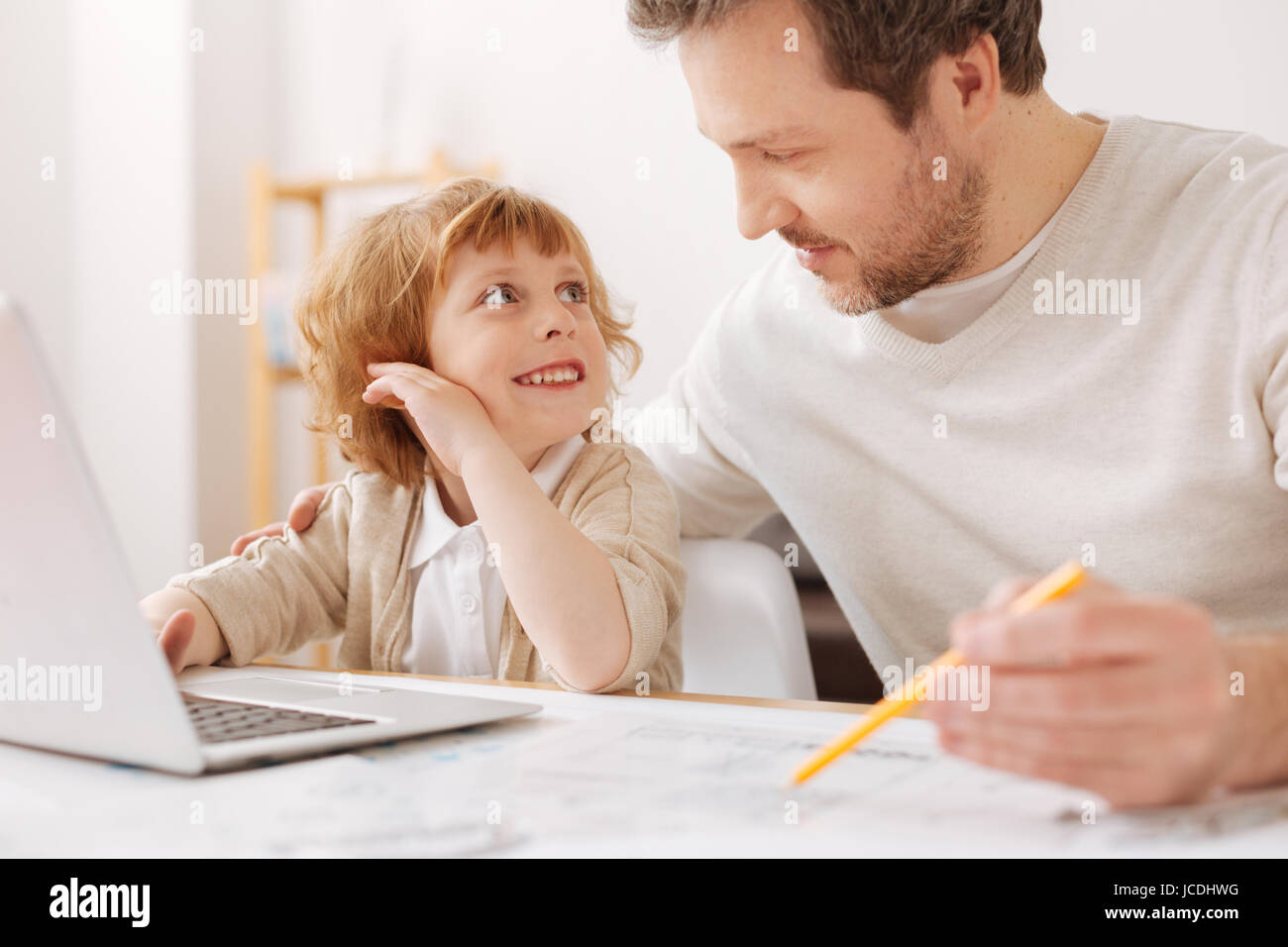 Positive delighted man-child looking at his father Stock Photo - Alamy