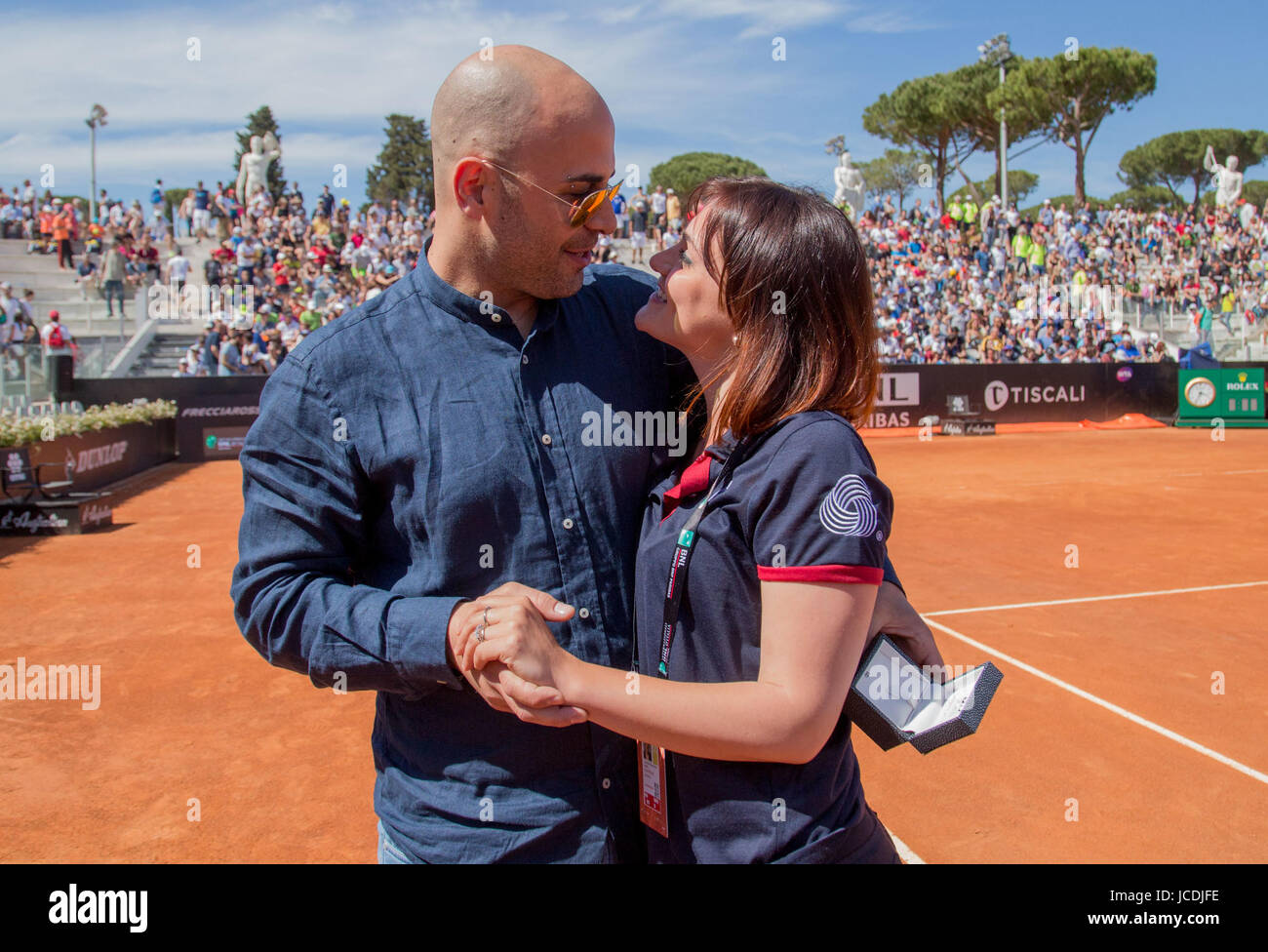 A tennis fan proposes to his girlfriend on the court during the Italian ...