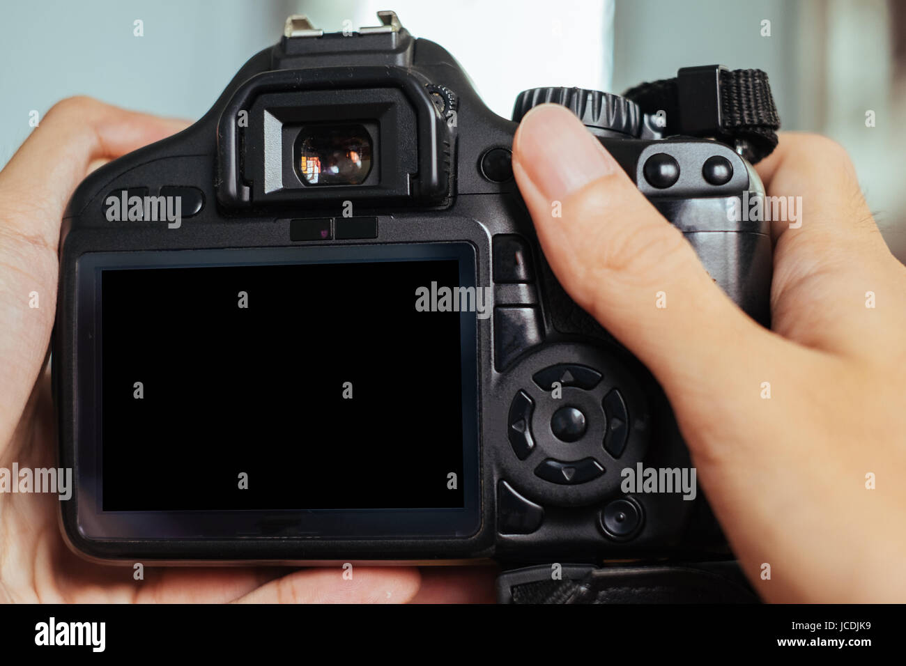 DSLR camera on human hands Stock Photo - Alamy