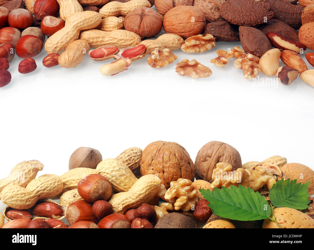 Double border of a selection of fresh nuts including almonds, hazelnuts ...