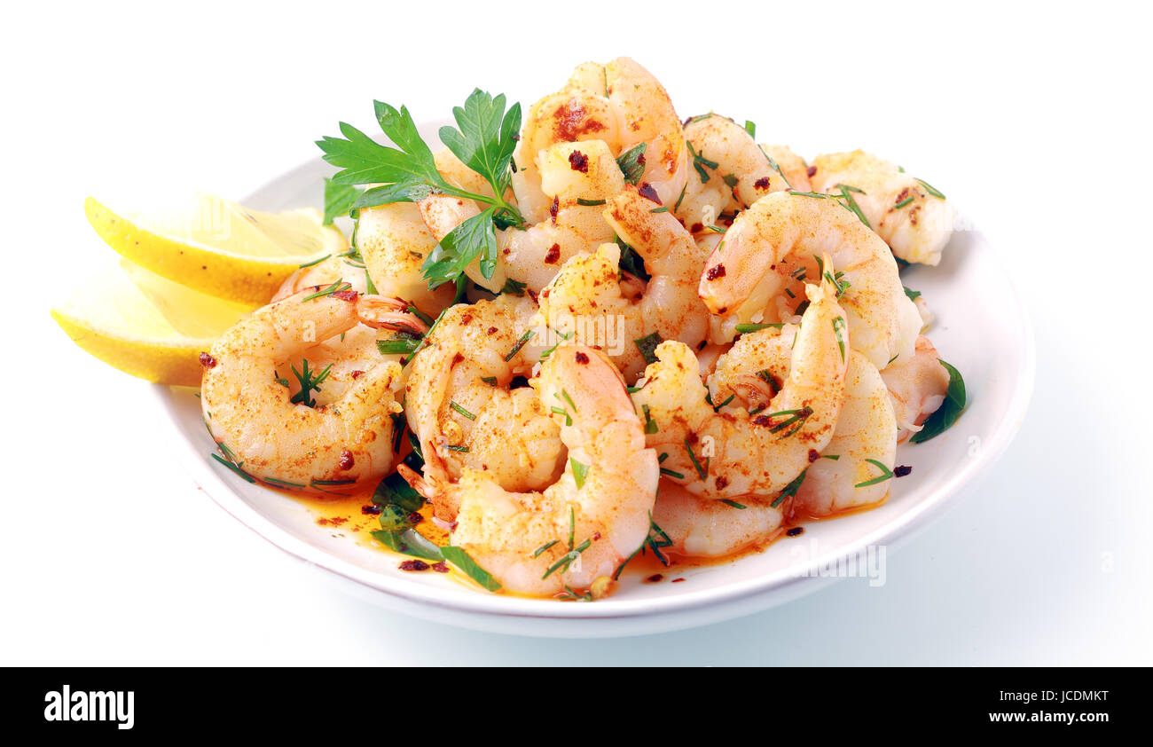 Seasoned savory pink prawns or shrimp tails grilled in fresh diced ...