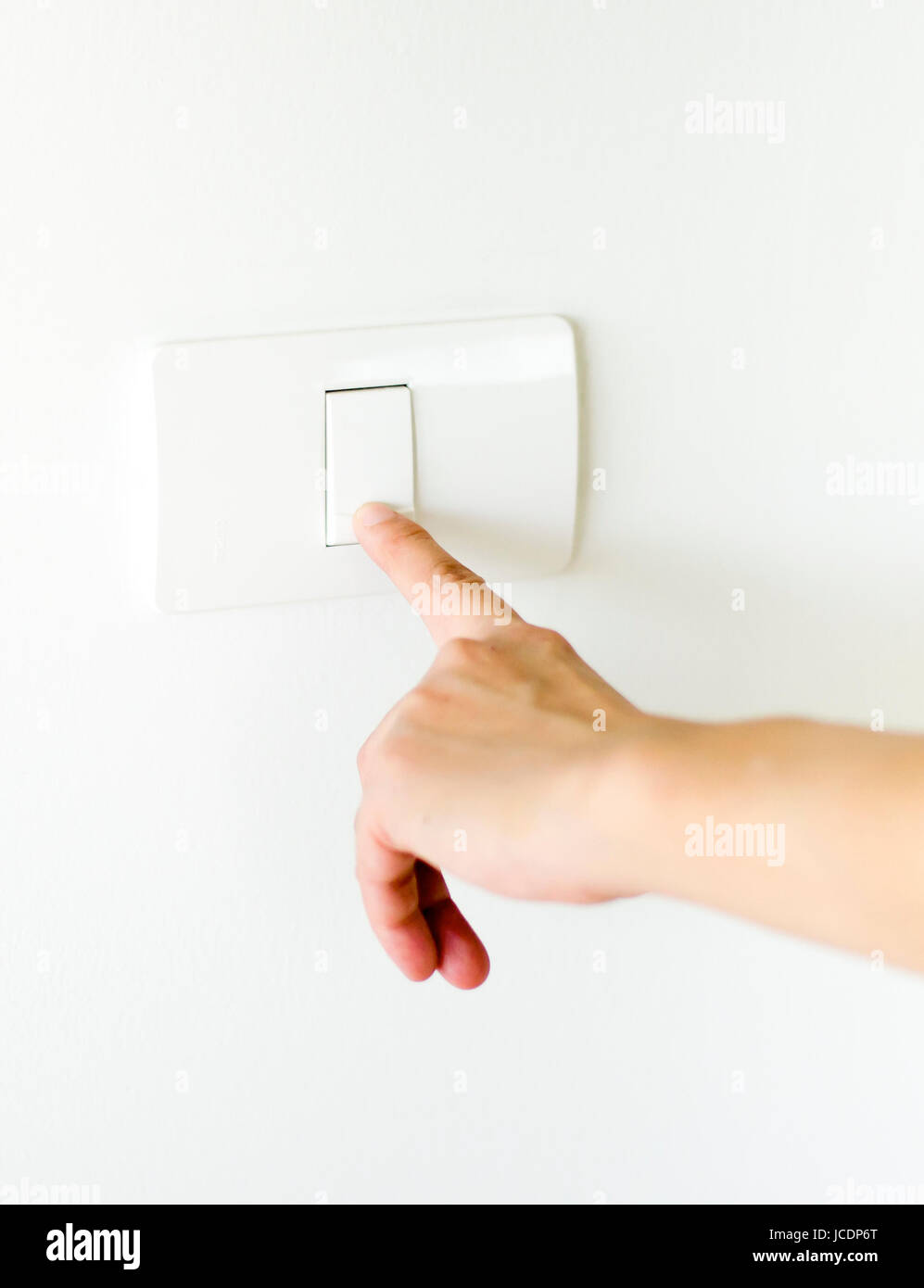 Modern Finger press on light button Stock Photo - Alamy