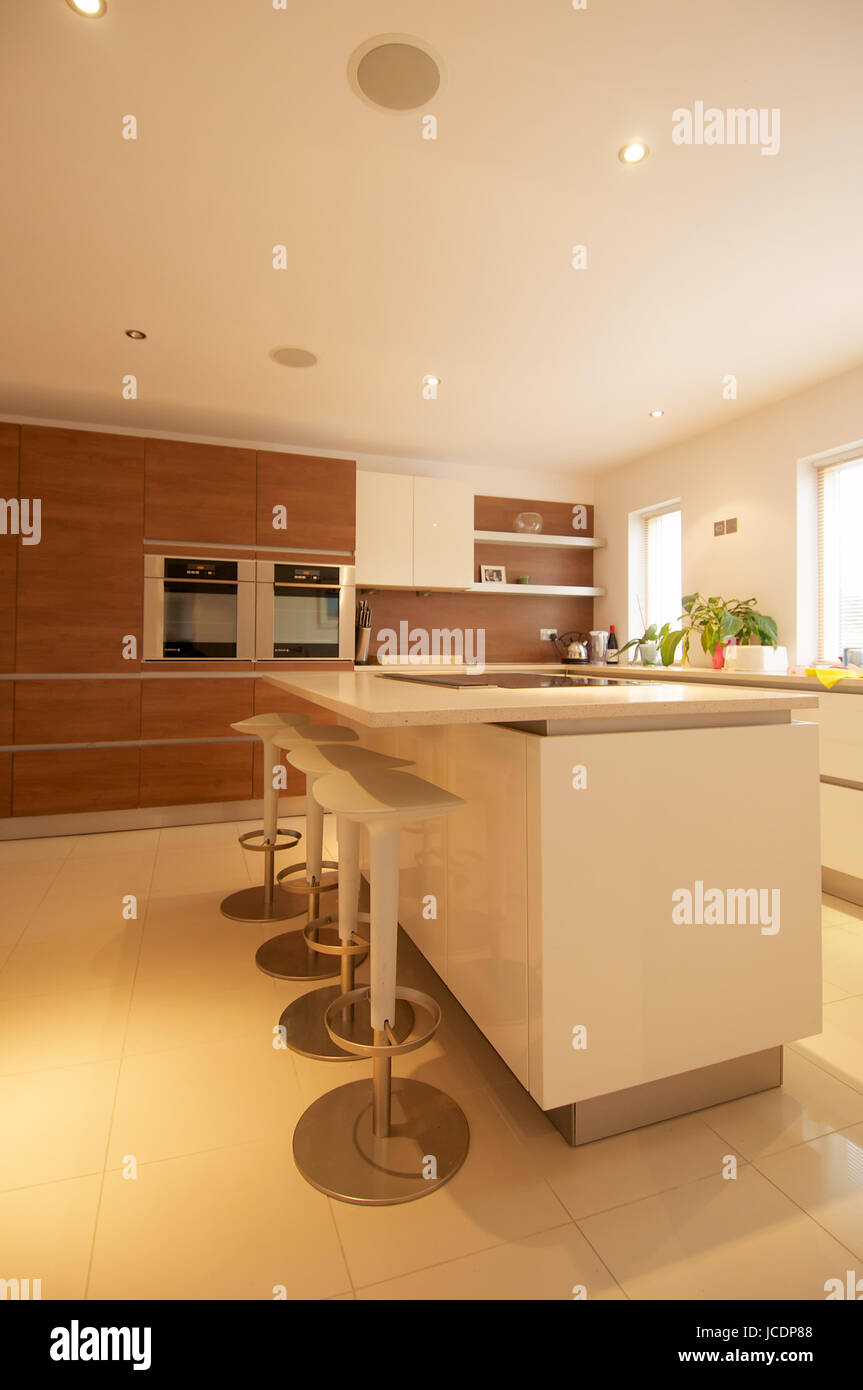 Interior of a modern house -kitchen with island Stock Photo - Alamy