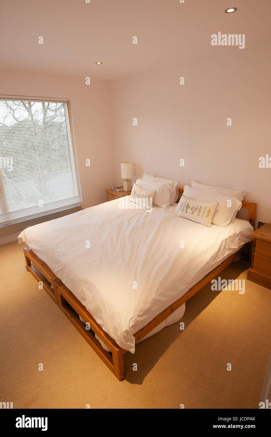 Interior of a modern house - bedroom with bed Stock Photo - Alamy