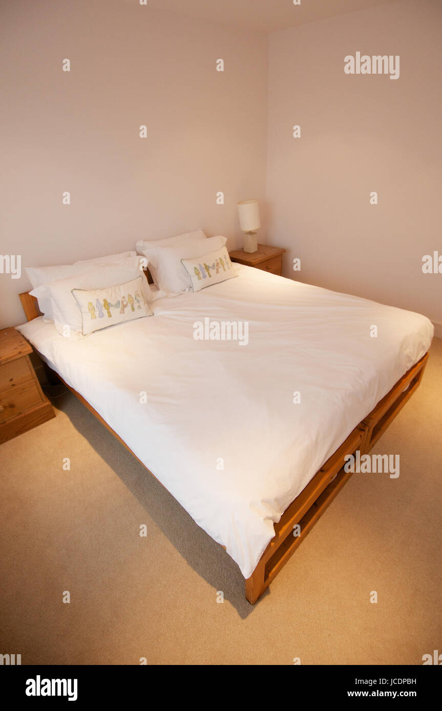 Interior of a modern house - bedroom with bed Stock Photo - Alamy