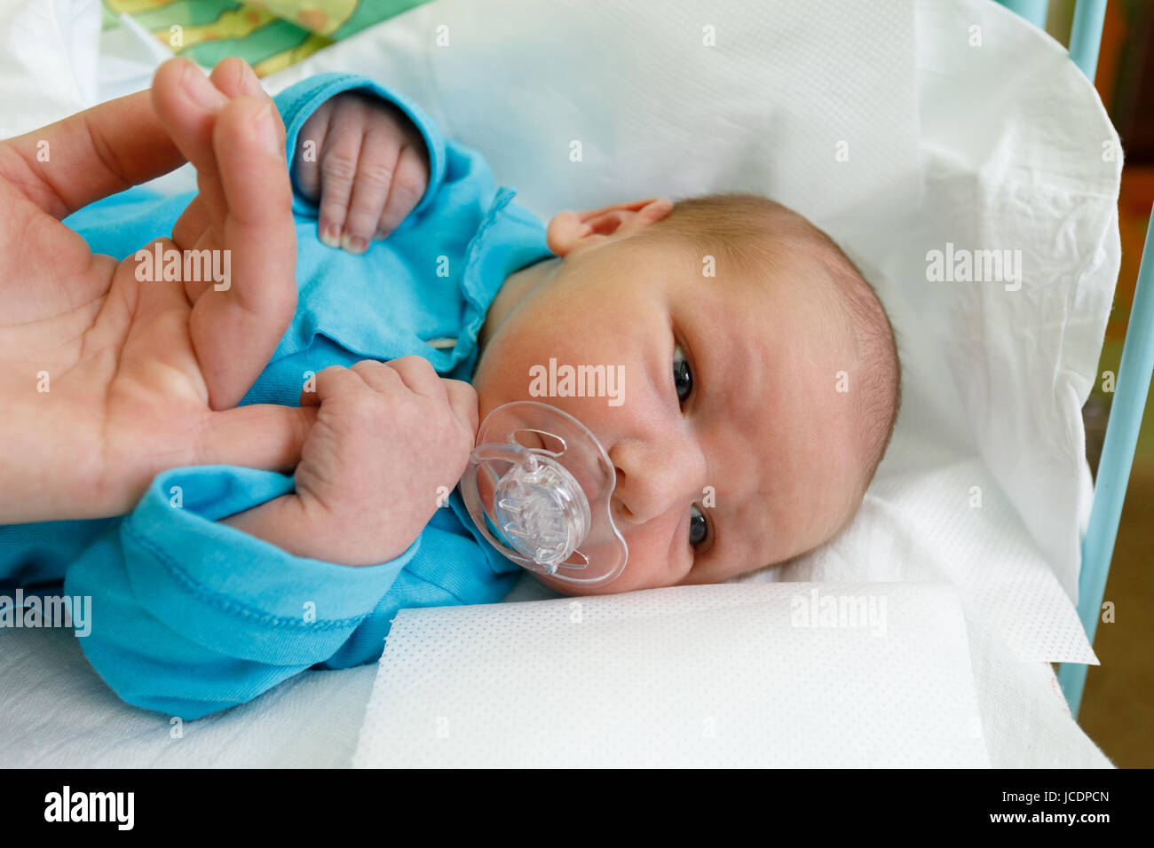 newborn baby infant in the hospital, the first hours of the new life ...