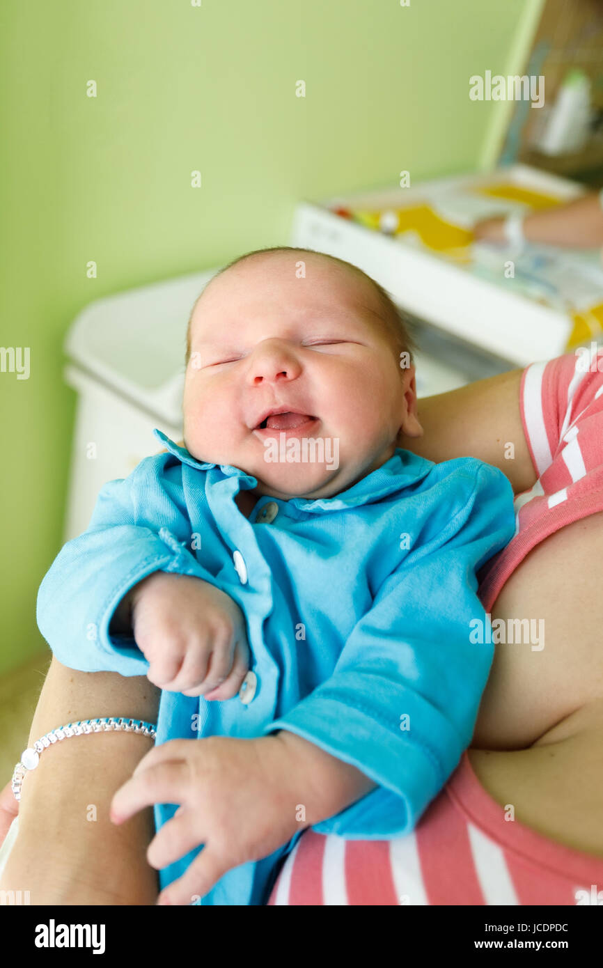 newborn baby infant in the hospital, the first hours of the new life ...