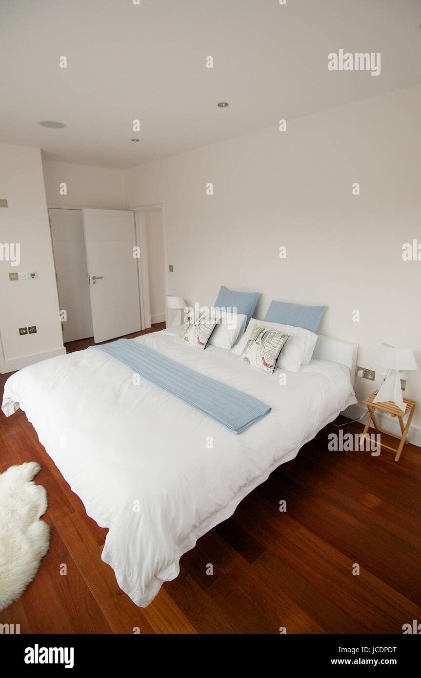 Interior of a modern house - bedroom with bed Stock Photo - Alamy