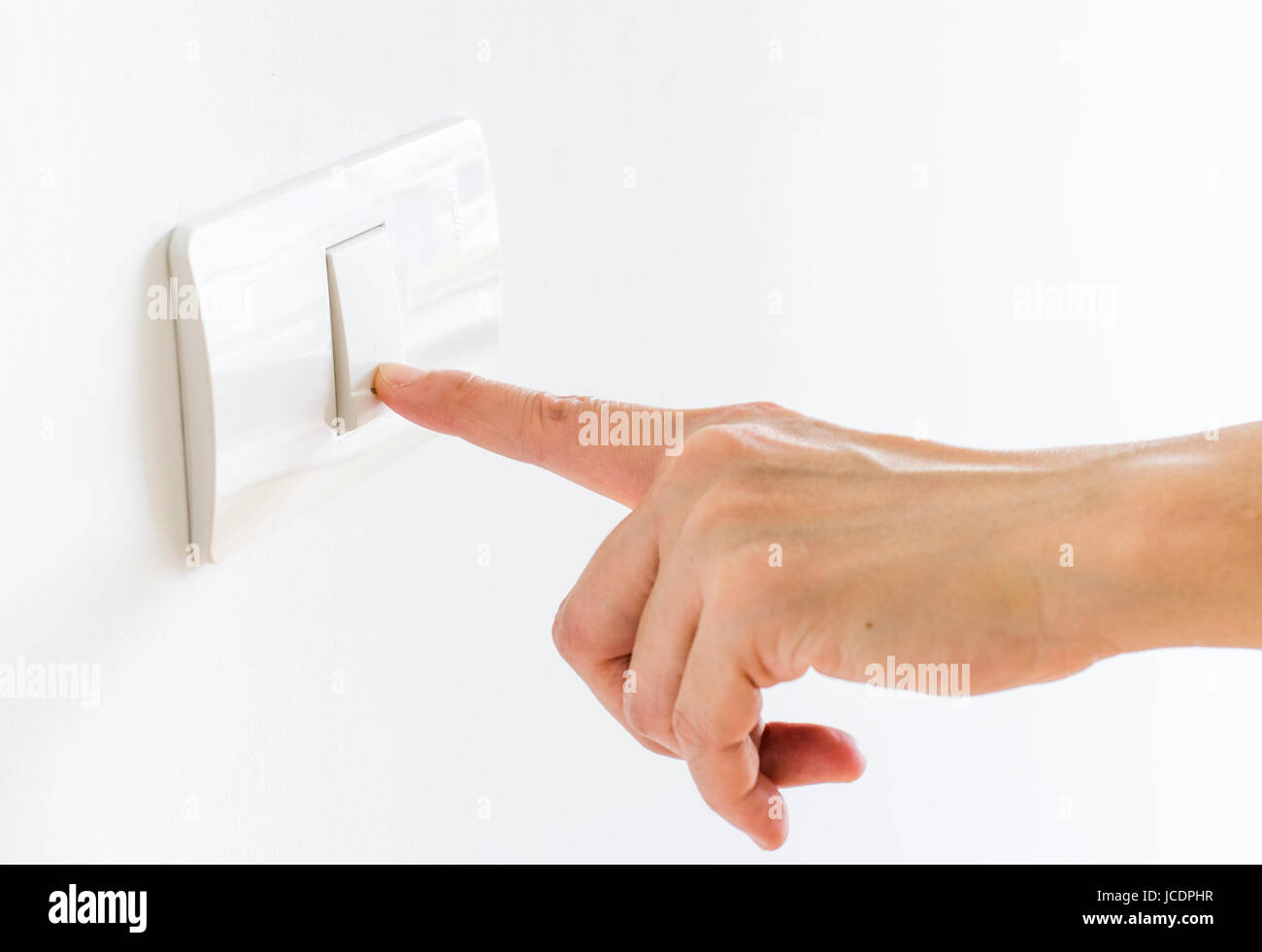 Light switch woman finger hi-res stock photography and images - Alamy