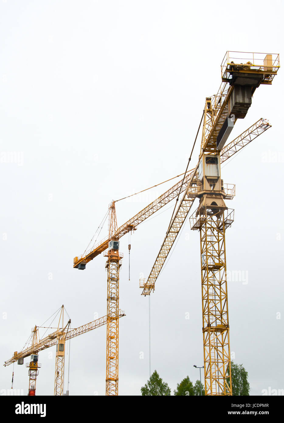 Industrial construction cranes in the city Stock Photo - Alamy
