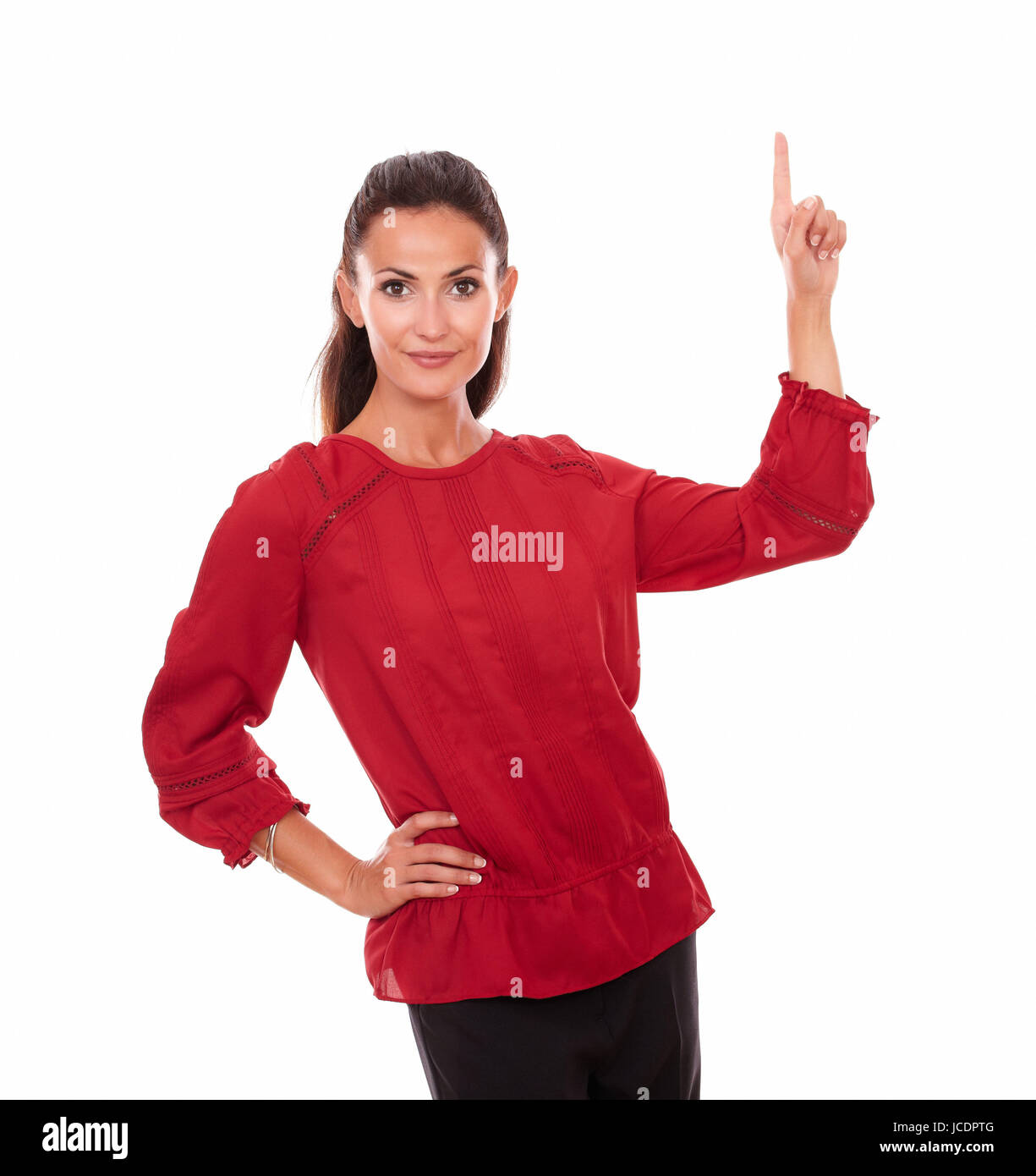 Portrait of young lady on red shirt pointing up and looking at you ...