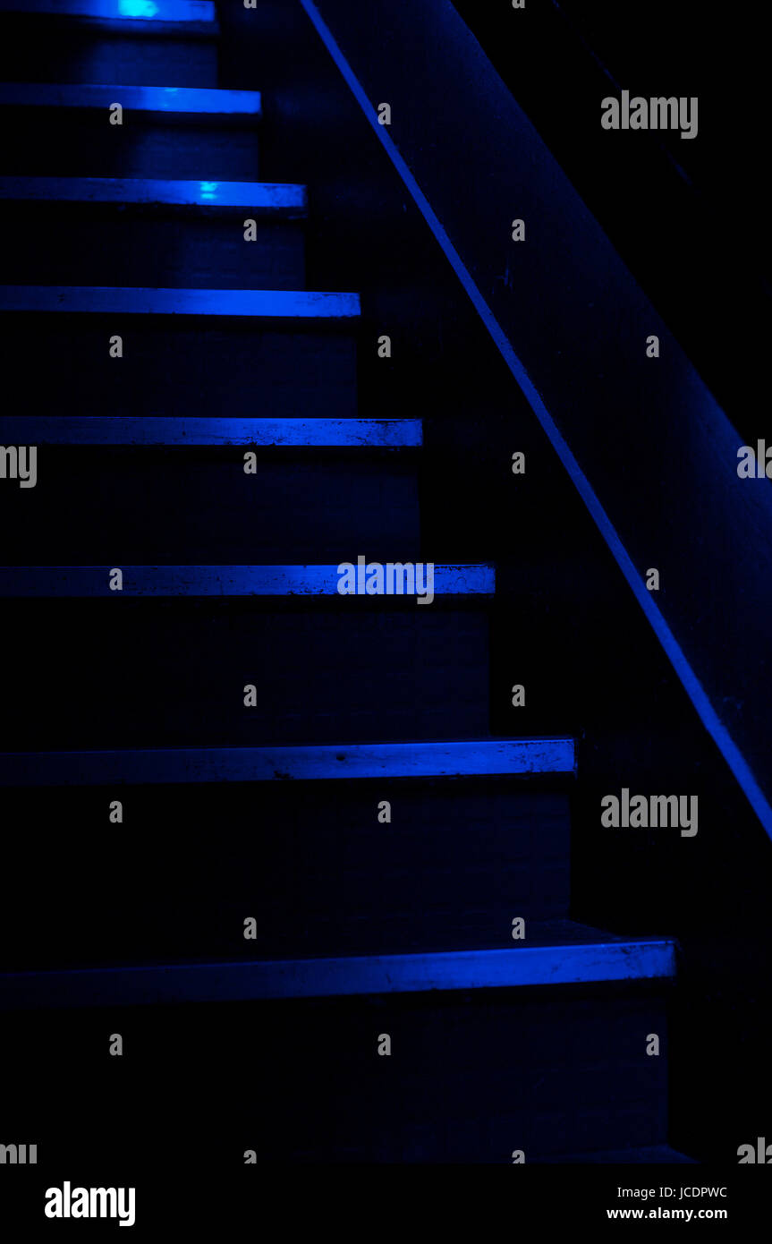 Staircase lit with a blue light Stock Photo - Alamy