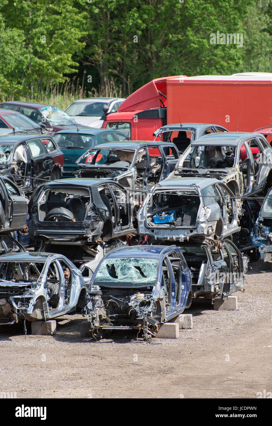 Old vehicles in scrap yard Stock Photo - Alamy