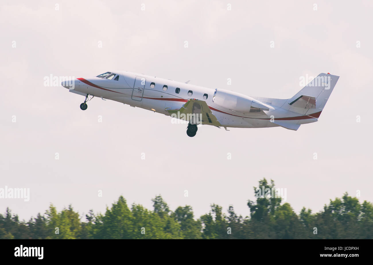Small commercial airplane taking off Stock Photo - Alamy