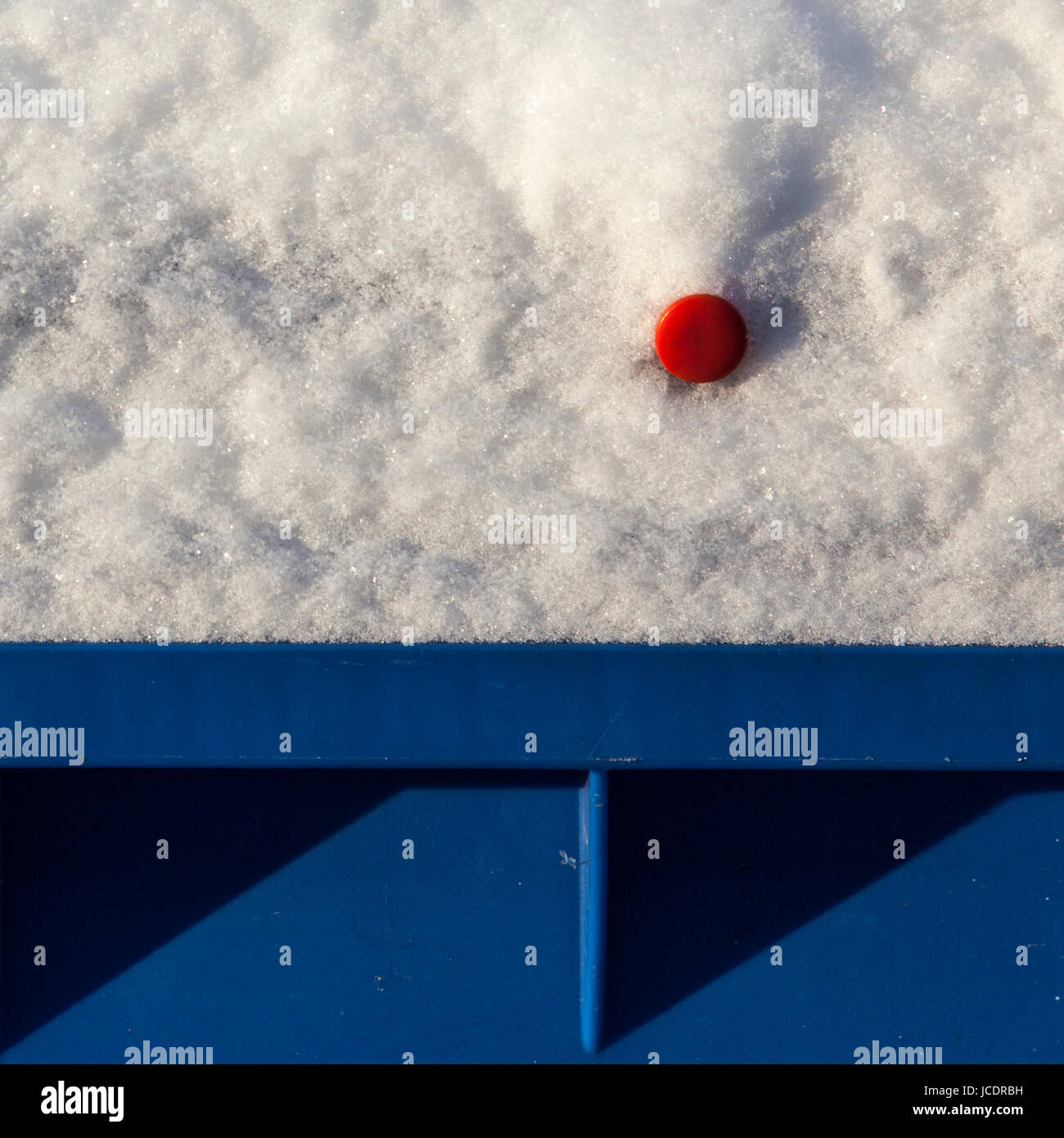 snow on blue paper container with red handle Stock Photo - Alamy