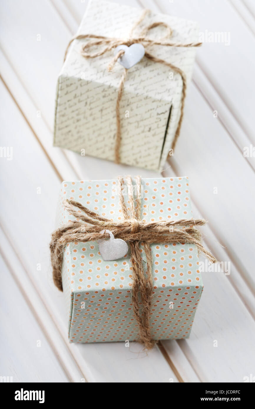 Handmade small present boxes with heart shaped tags Stock Photo - Alamy