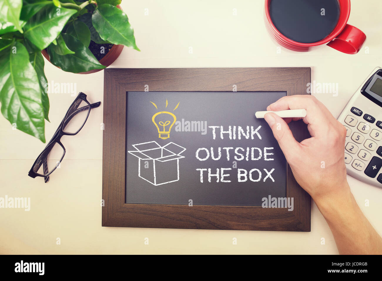 Man drawing Think outside the box on chalkboard Stock Photo - Alamy