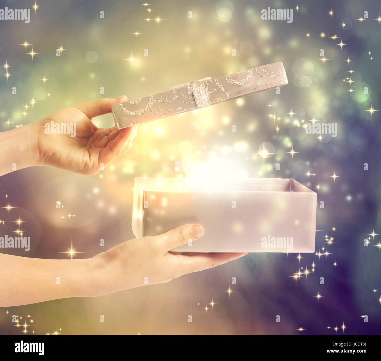 A magical glowing present box being opened Stock Photo - Alamy