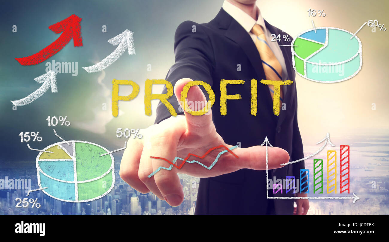 Business man pointing PROFIT with colorful graphs Stock Photo - Alamy