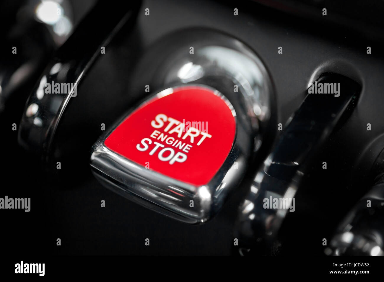Detail on a red start button in a car Stock Photo - Alamy