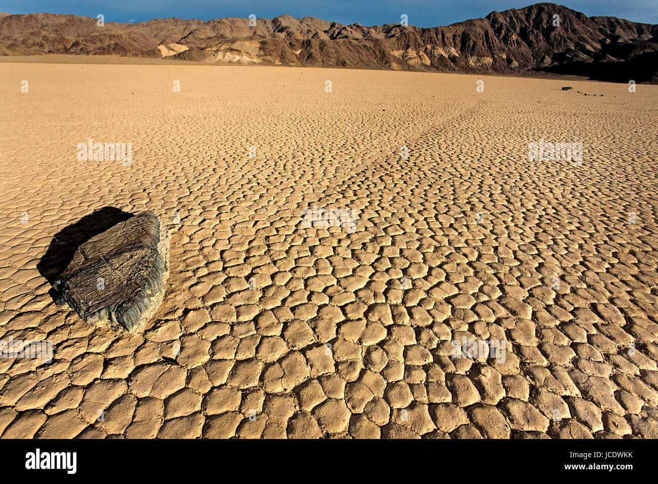 single boulder with sliding trail mark on ground at the Racetrack ...