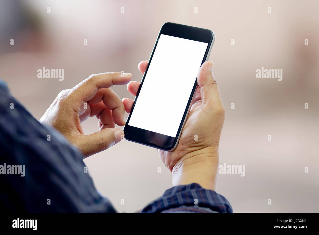 Man using smartphone on blur background. Blank screen smartphone for ...